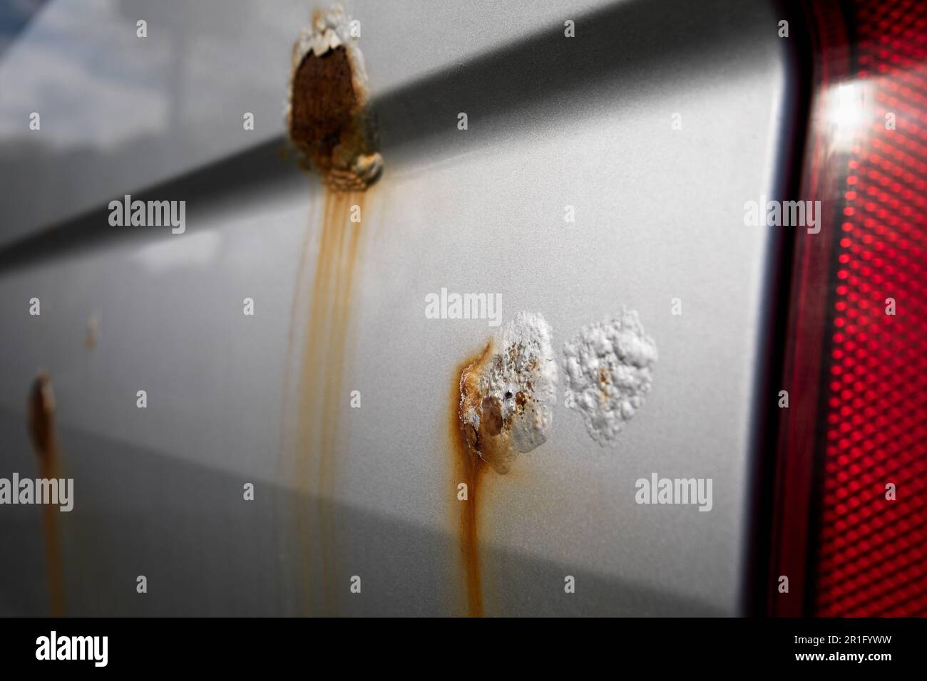 Blown paint bubble and rust spot on the car. Peeled paint Stock Photo ...