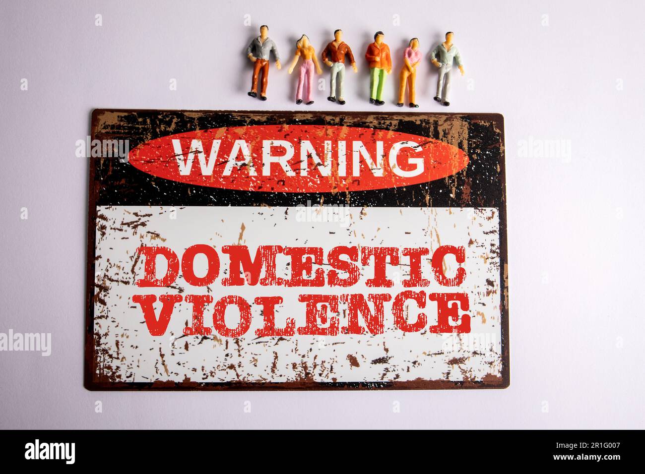 Domestic Violence. Warning sign with text and miniature human figures ...