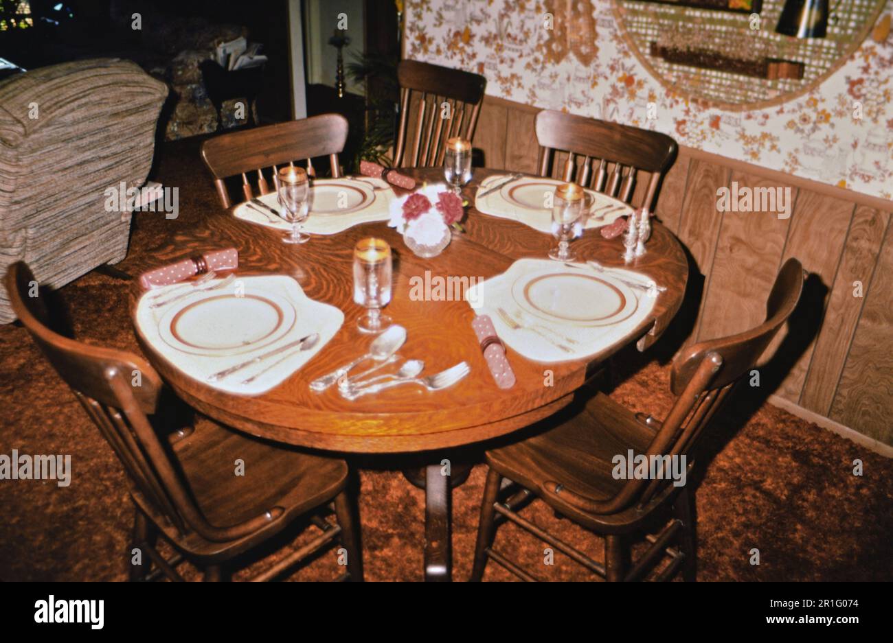 Place setting at a dining room table in a typical America home in late ...
