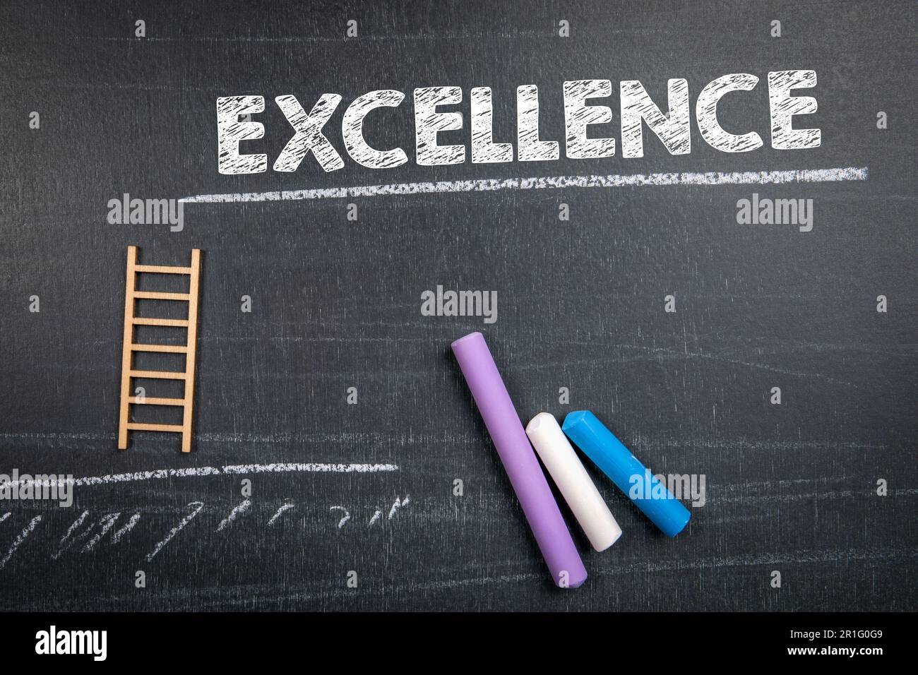 EXCELLENCE Concept. Miniature stairs, colorful pieces of chalk on a ...