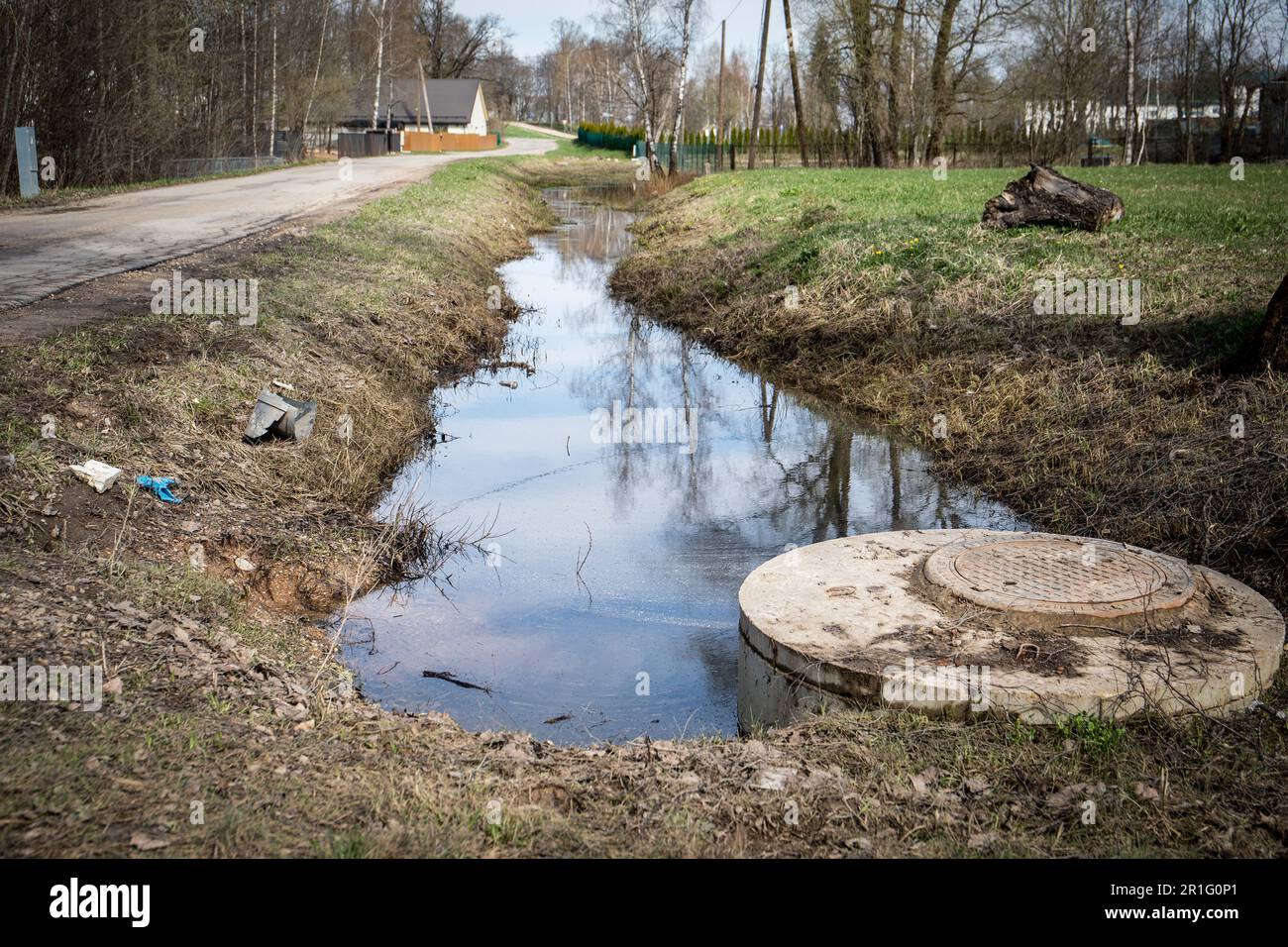 Sewer well and waste. Ditch to prevent flooding, spring thaw Stock ...