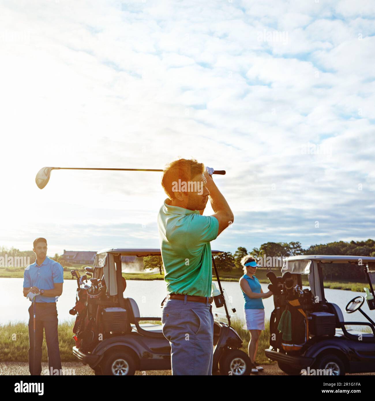 Its a great weekend for golf. a man playing a round of golf with his ...