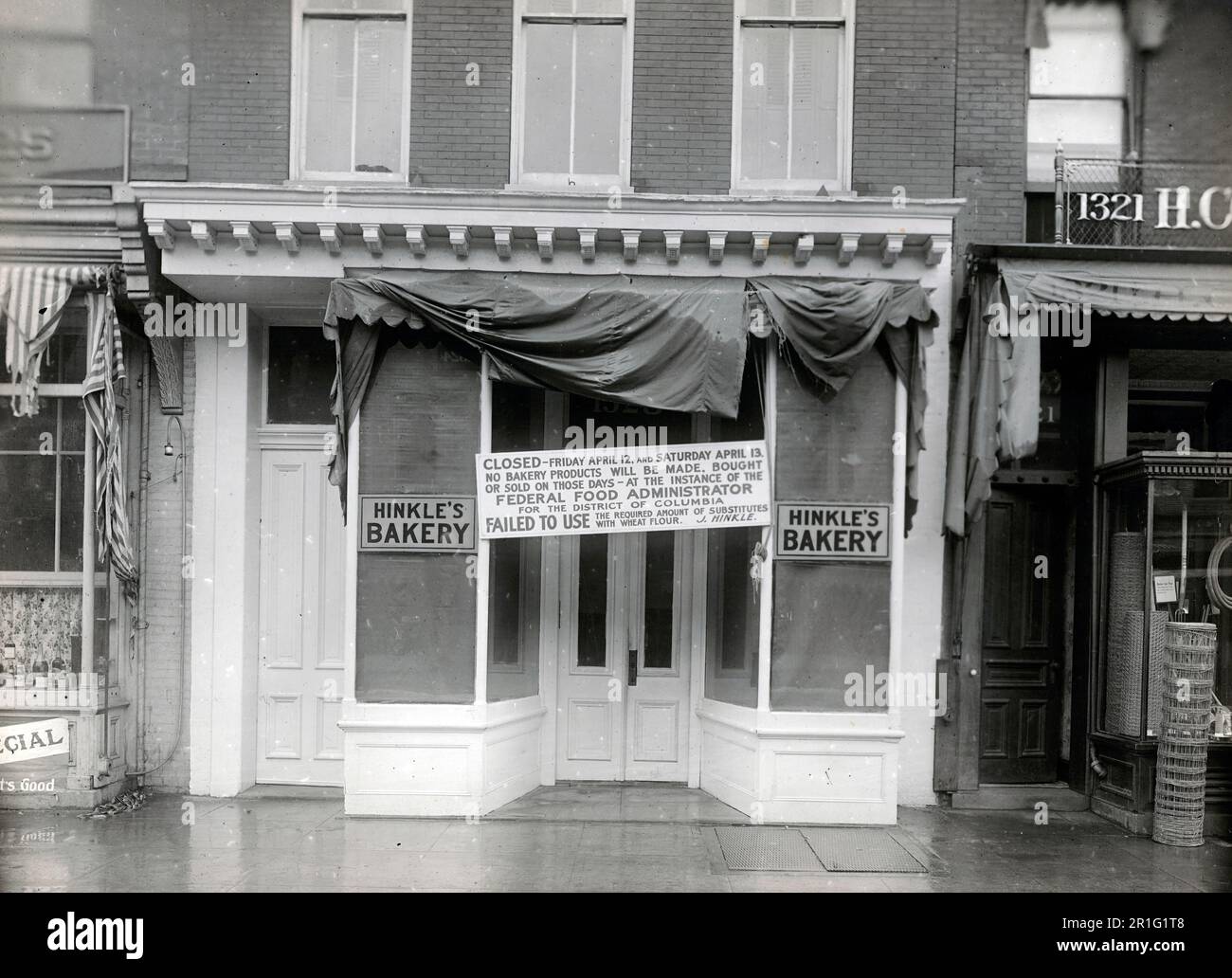 Archival Photo: Photograph shows a large sign posted across the ...