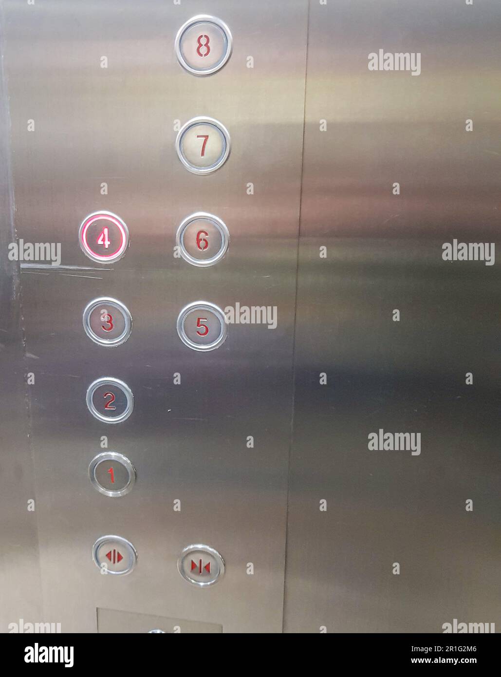 Close-up of the numbers on the buttons in a modern metal elevator ...