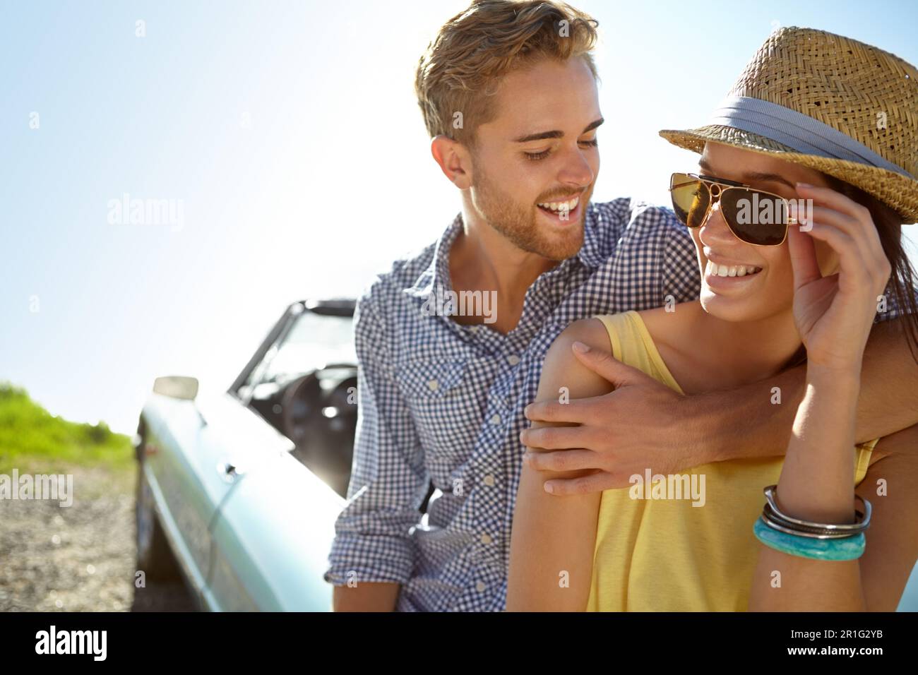 Road trip travel, car park and couple hug on holiday bonding adventure ...