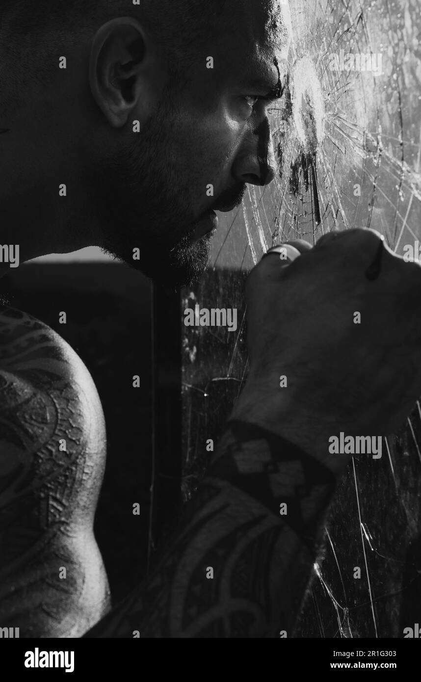 Confident attractive man with serious face. Gang man, criminal guy ...