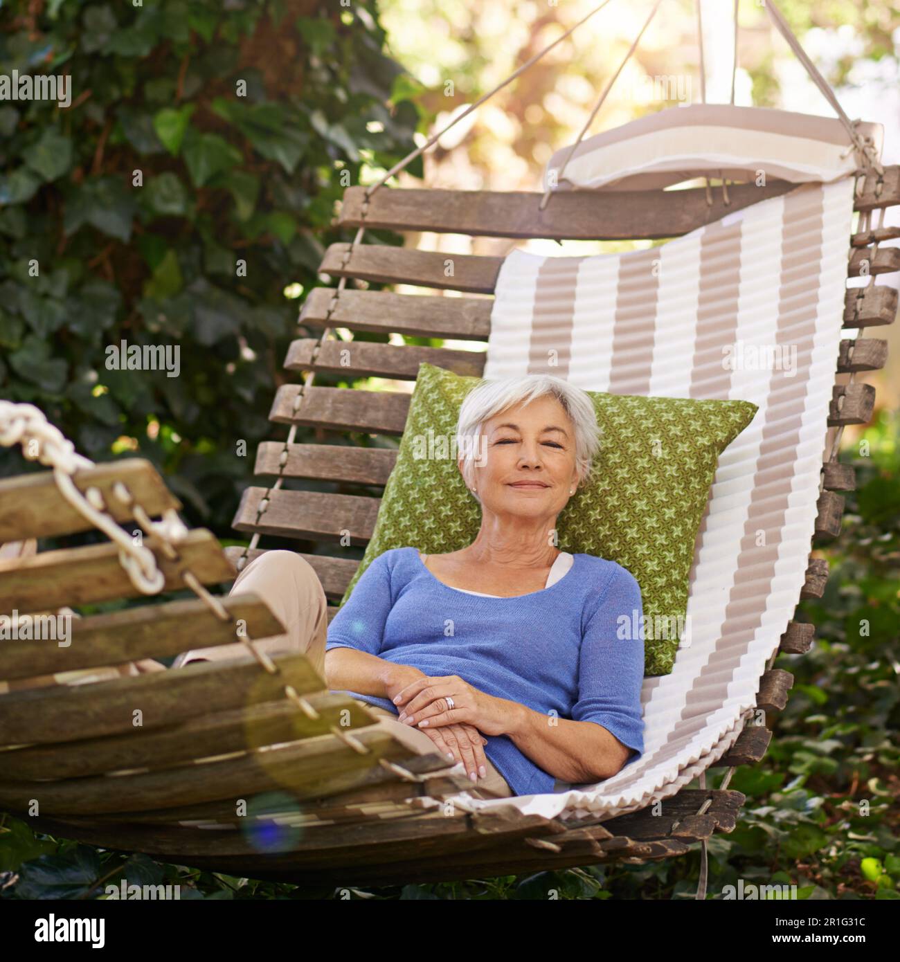 Elderly, woman and sleep on hammock during retirement and relax on ...