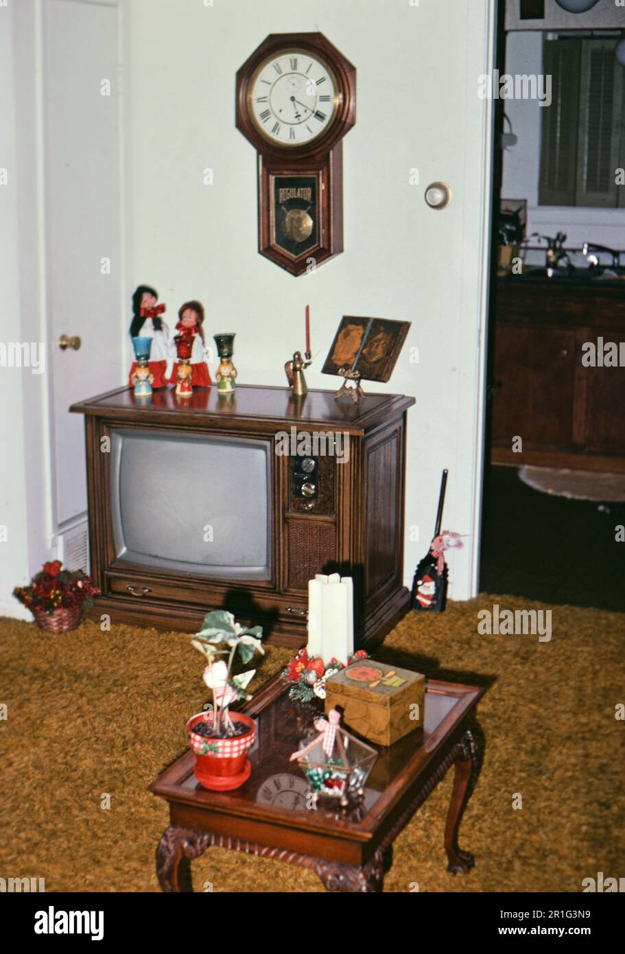 A living room in an American house with a console television and some ...