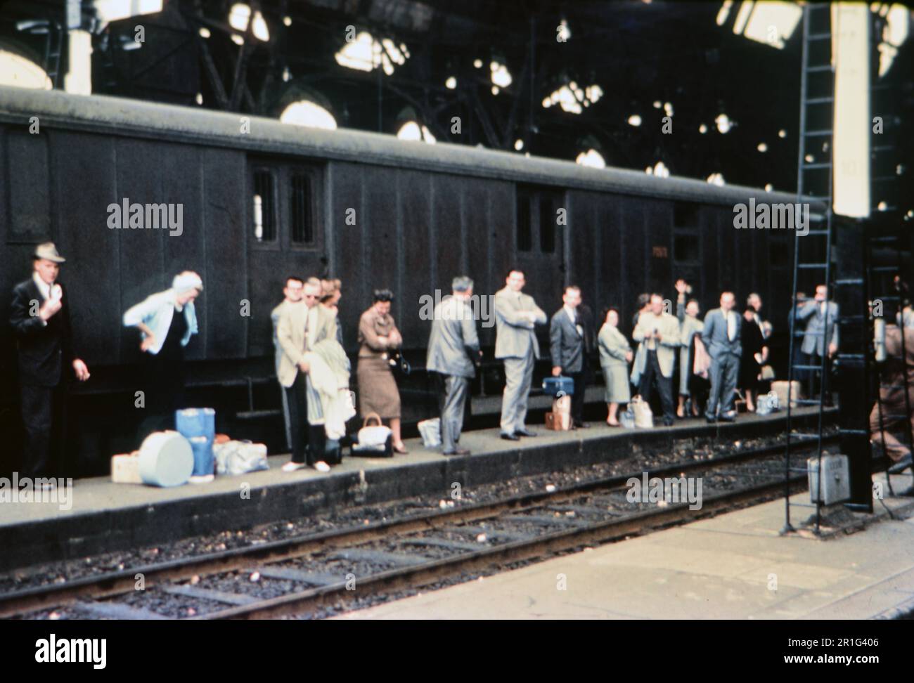 Passengers waiting for a train at the Milano Italy train station ca ...