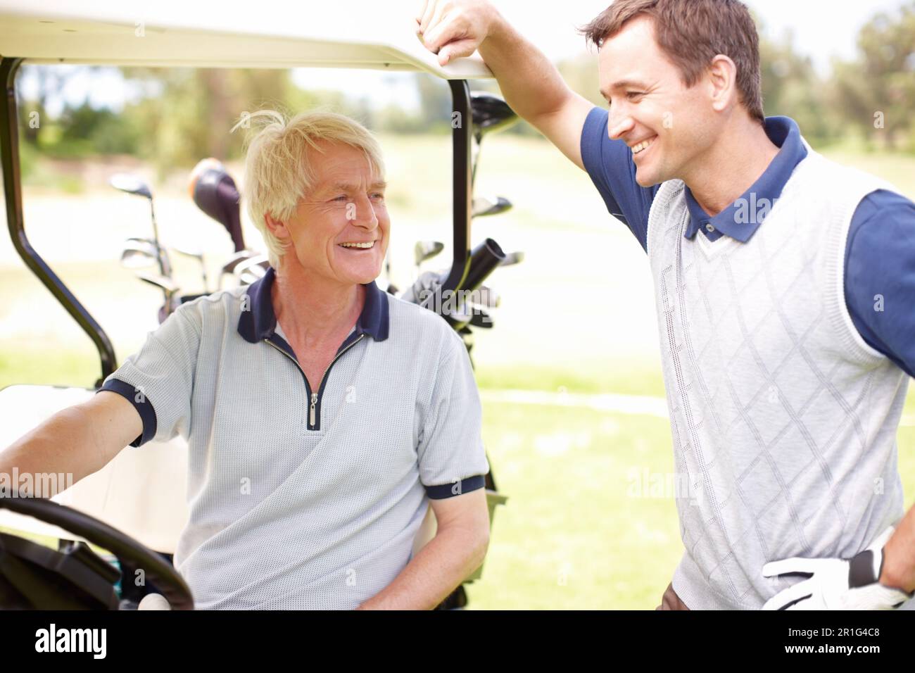 Are you ready for the next hole. Golfing buddies catching up while on ...