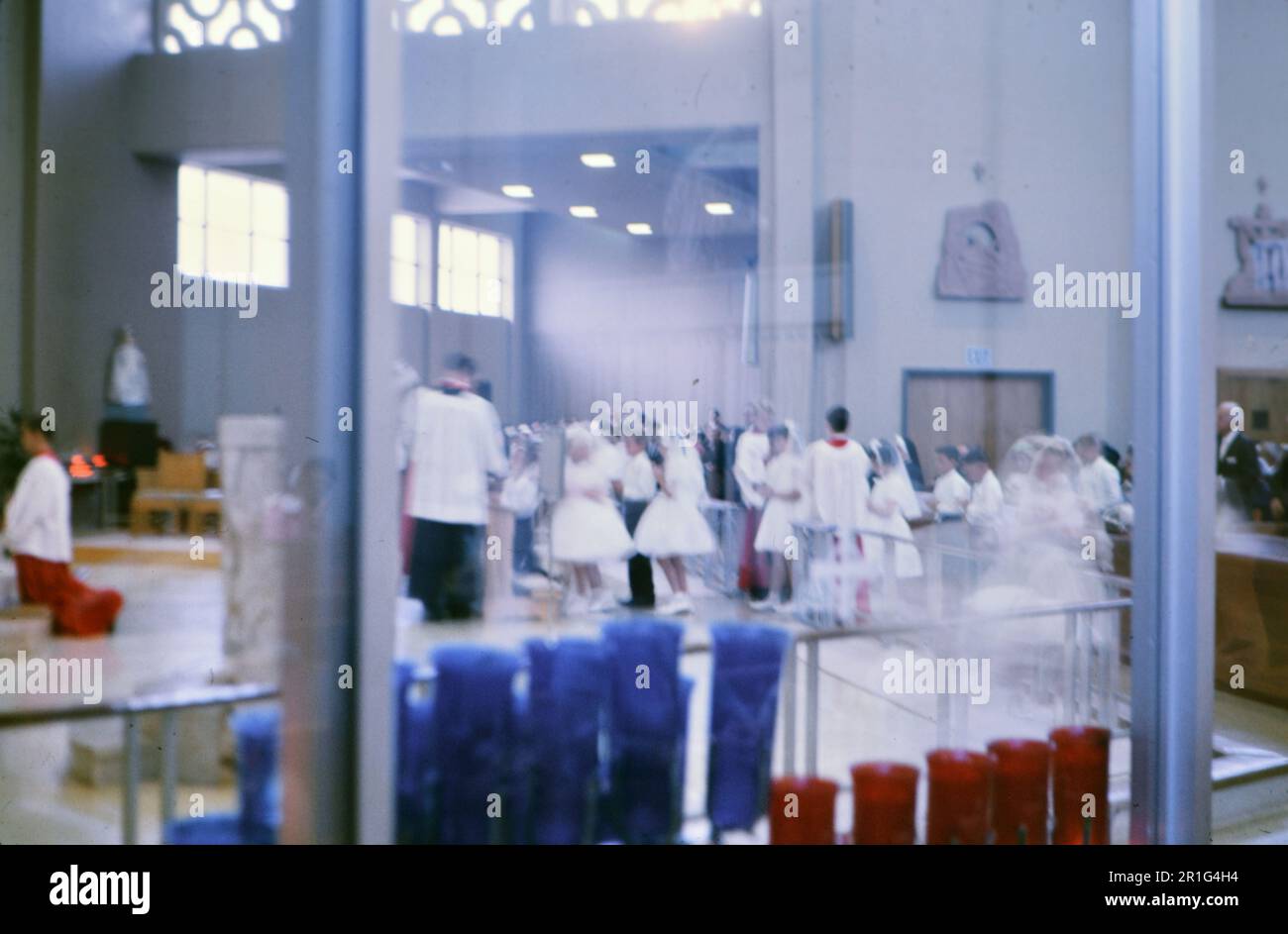 Young boys and girls participating in a First Communion ca. 1960s Stock ...