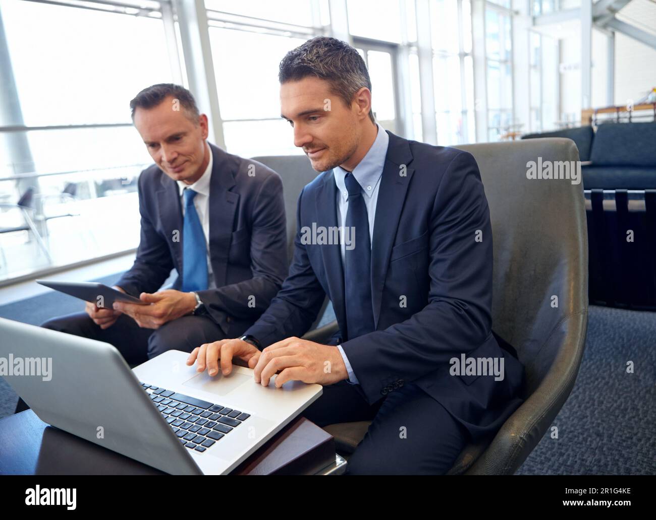 Laptop, planning and business people in corporate lounge review ...