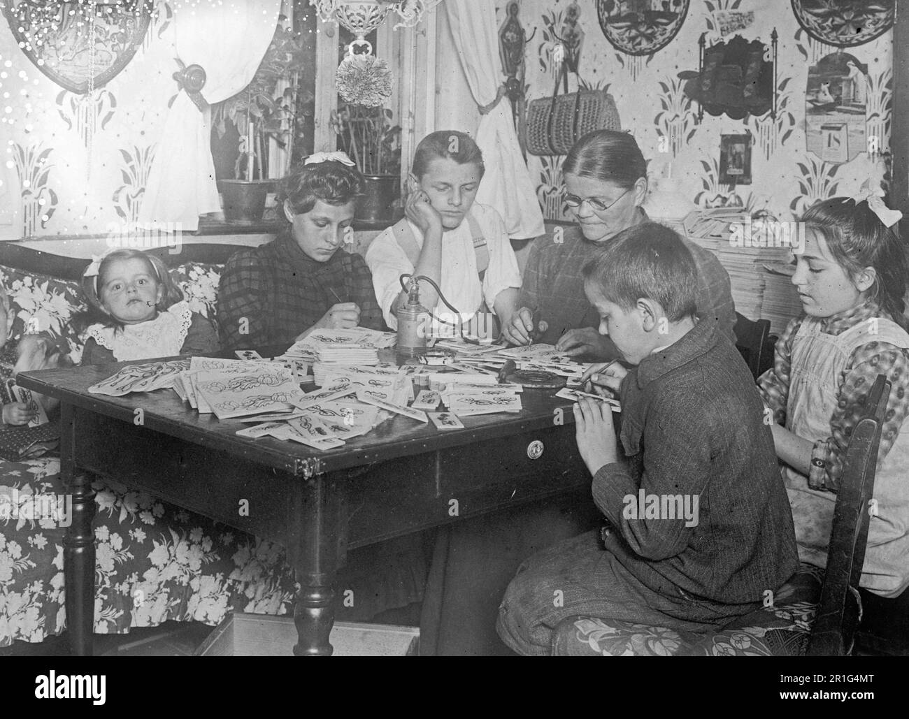 Archival Photo: German children helping make toys in their home ca ...