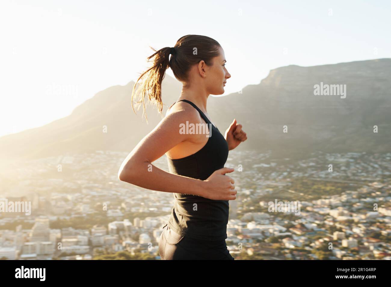 Running, fitness and woman with balance, exercise and cardio with ...