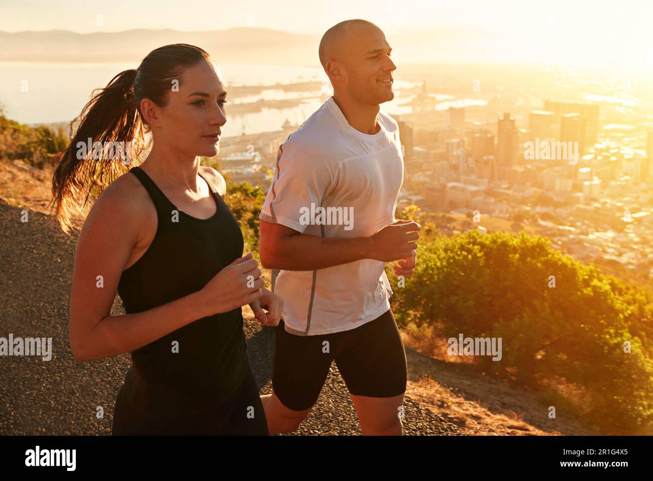 Sunrise, training and running couple as workout or morning exercise for ...