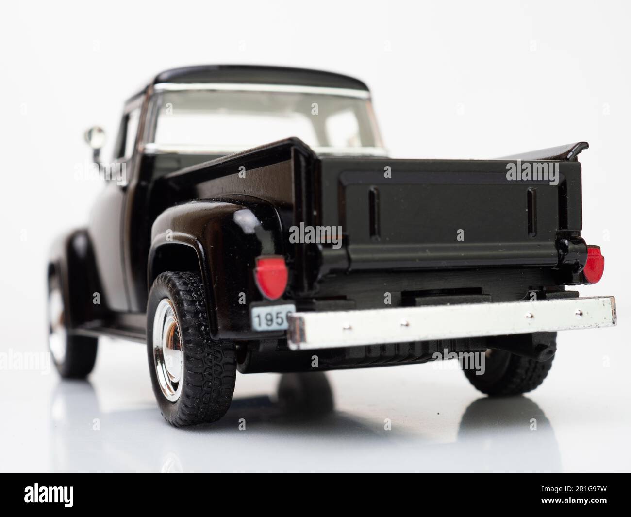 Rear view of a black truck miniature toys isolated on white Stock Photo ...