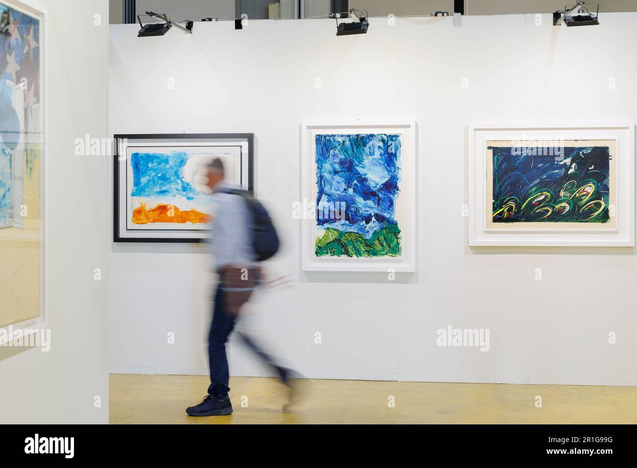 Man Walking and Admiring Paintings in a Modern Art Gallery Stock Photo ...