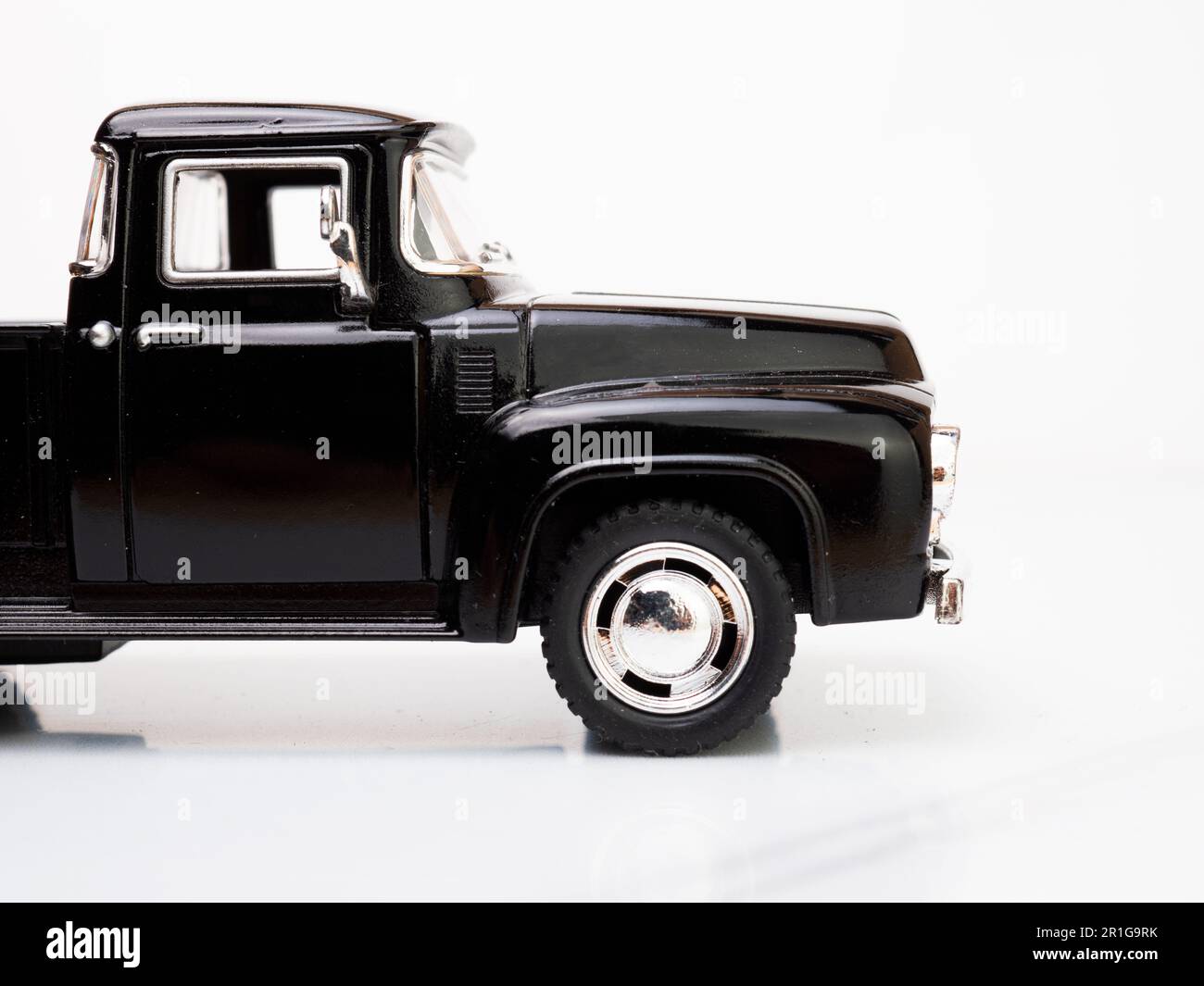 Side view of a black truck miniature toys Stock Photo - Alamy