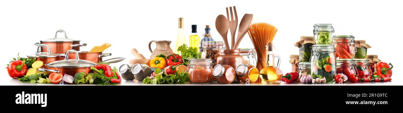 Assorted food products and kitchen utensils isolated on white ...