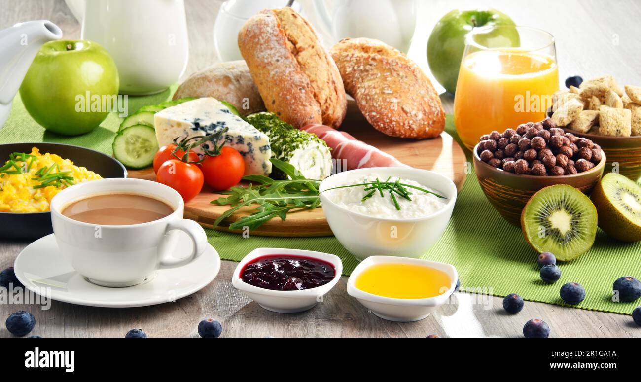 Breakfast served with coffee, orange juice, cheese, cereals and ...