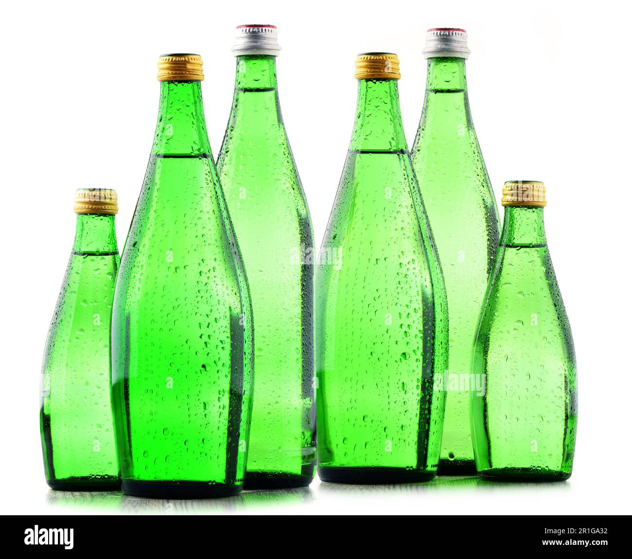 Glass bottles of mineral water isolated on white background Stock Photo - Alamy
