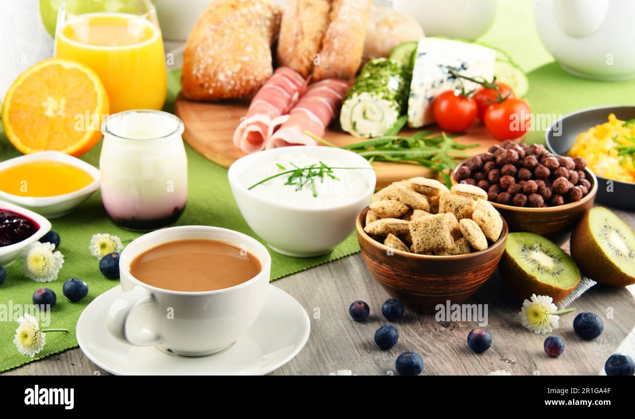 Breakfast served with coffee, orange juice, cheese, cereals and ...