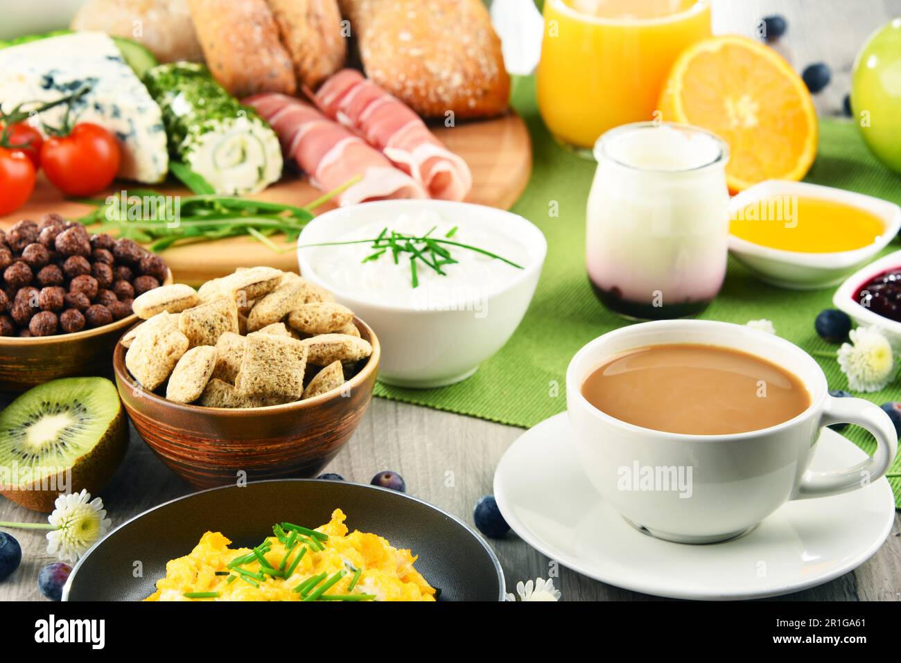 Breakfast served with coffee, orange juice, cheese, cereals and ...