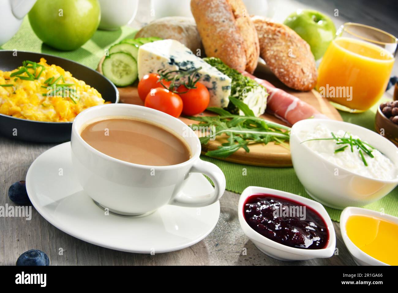 Breakfast served with coffee, orange juice, cheese, cereals and ...