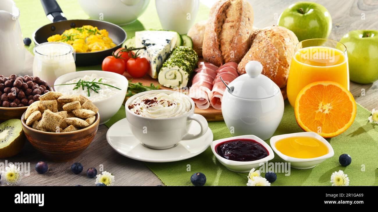 Breakfast served with coffee, orange juice, cheese, cereals and ...