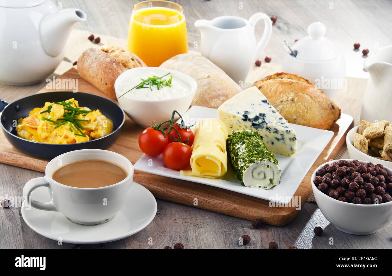 Breakfast served with coffee, orange juice, cheese, cereals and ...