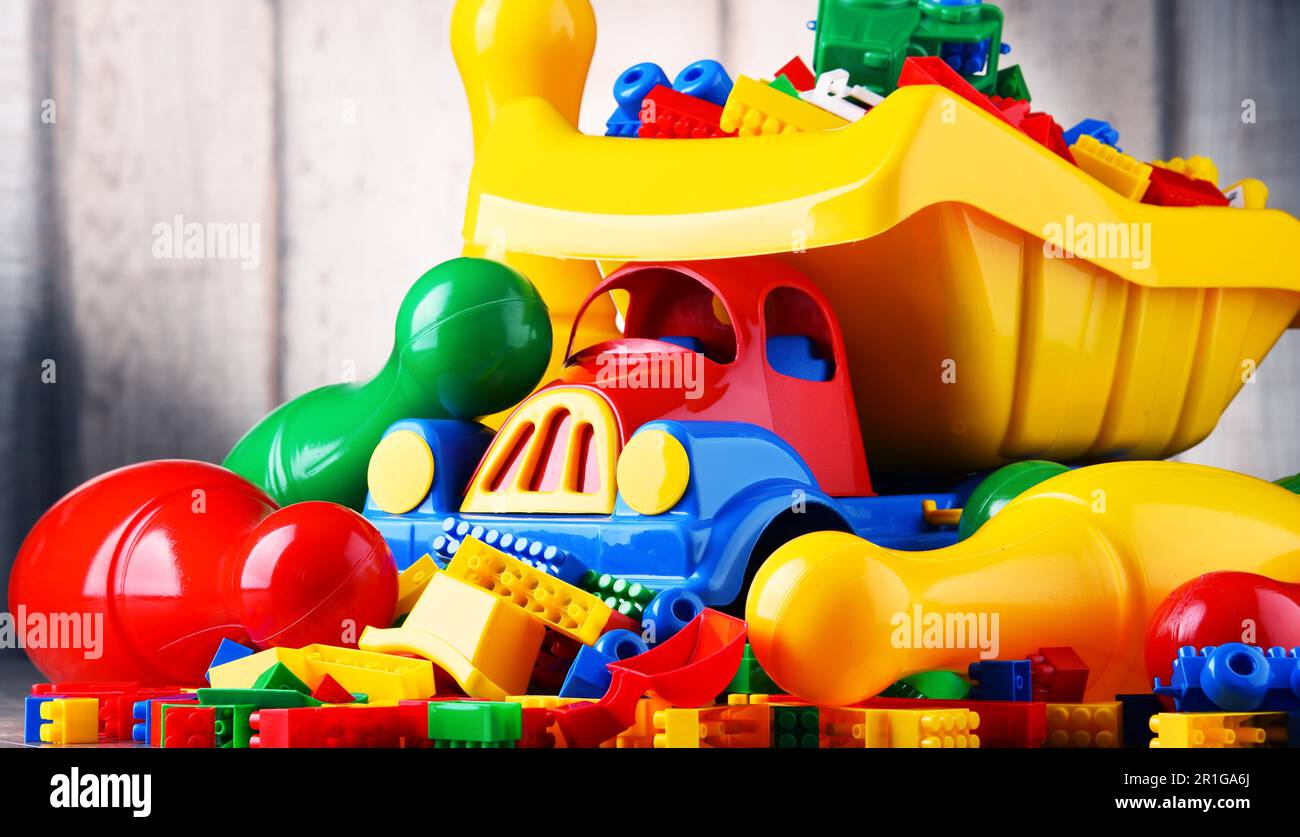 Colorful plastic toys in children's room Stock Photo - Alamy