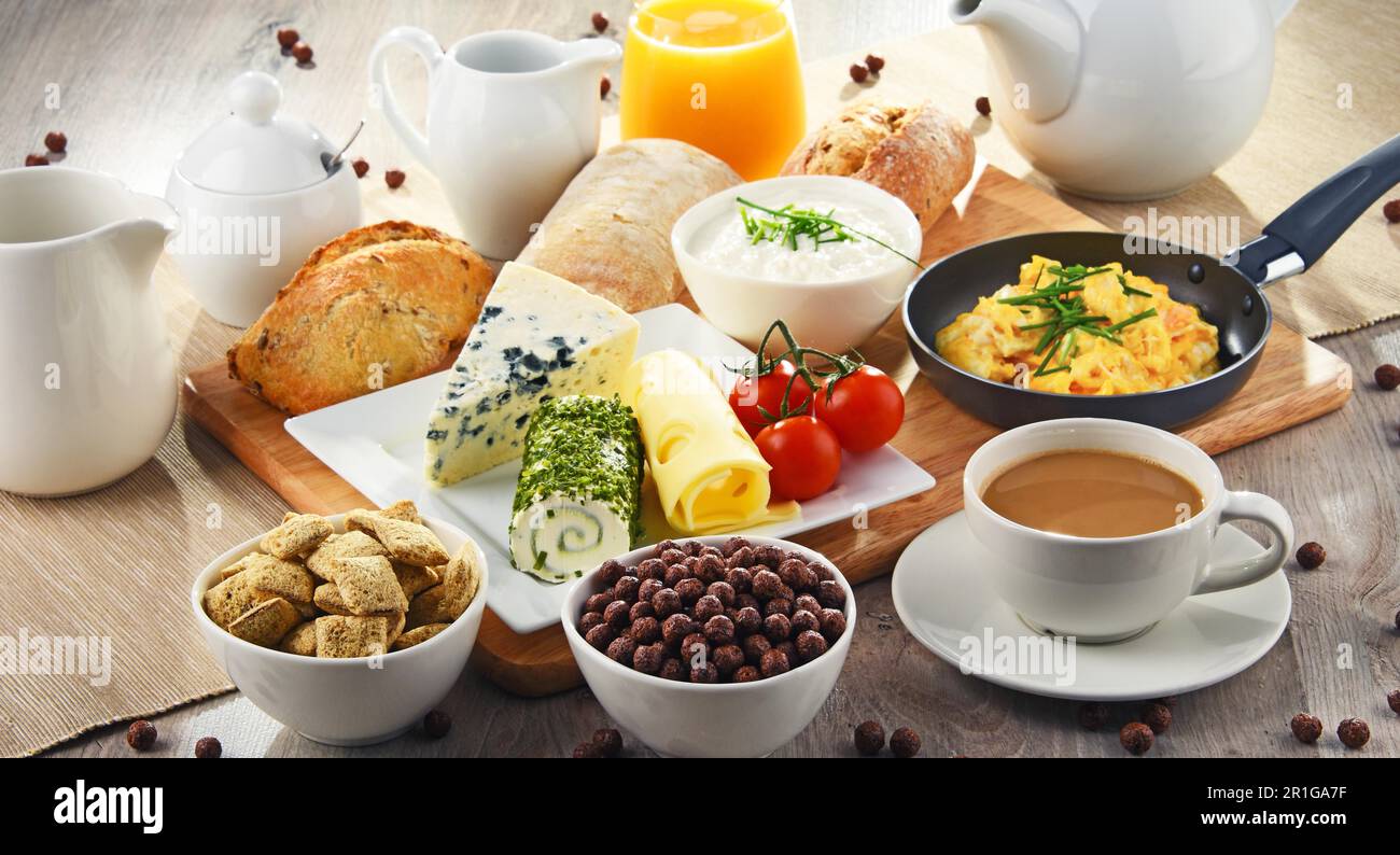 Breakfast served with coffee, orange juice, cheese, cereals and ...