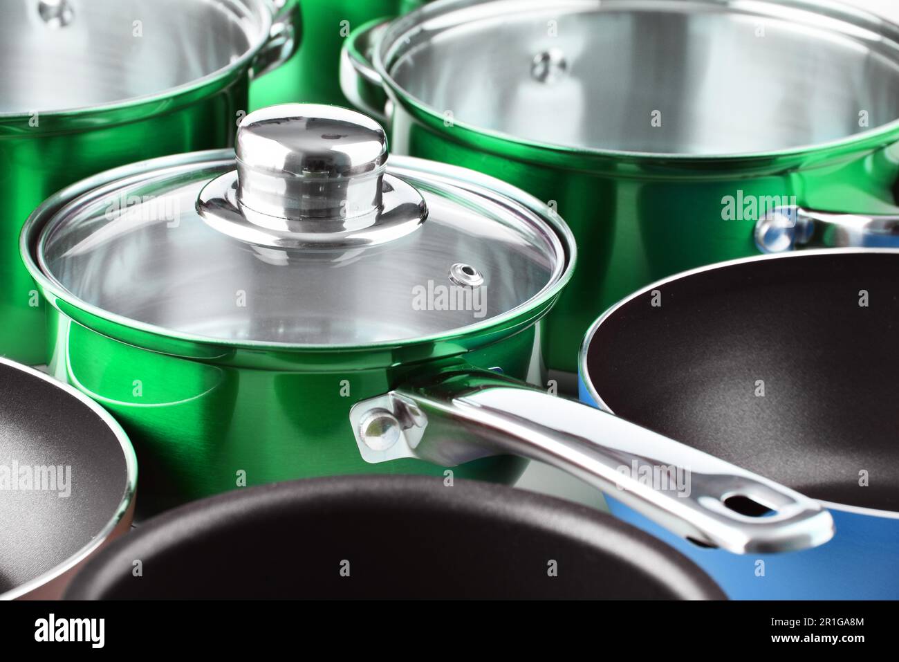 Composition with a set of steel pots Stock Photo - Alamy