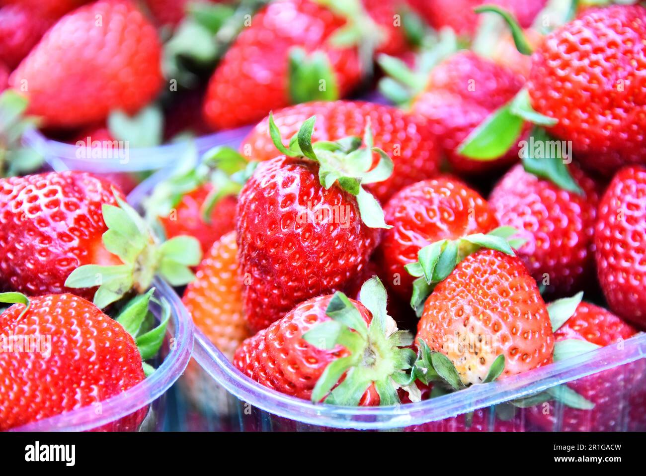 Fresh strawberries on street market stall Stock Photo - Alamy