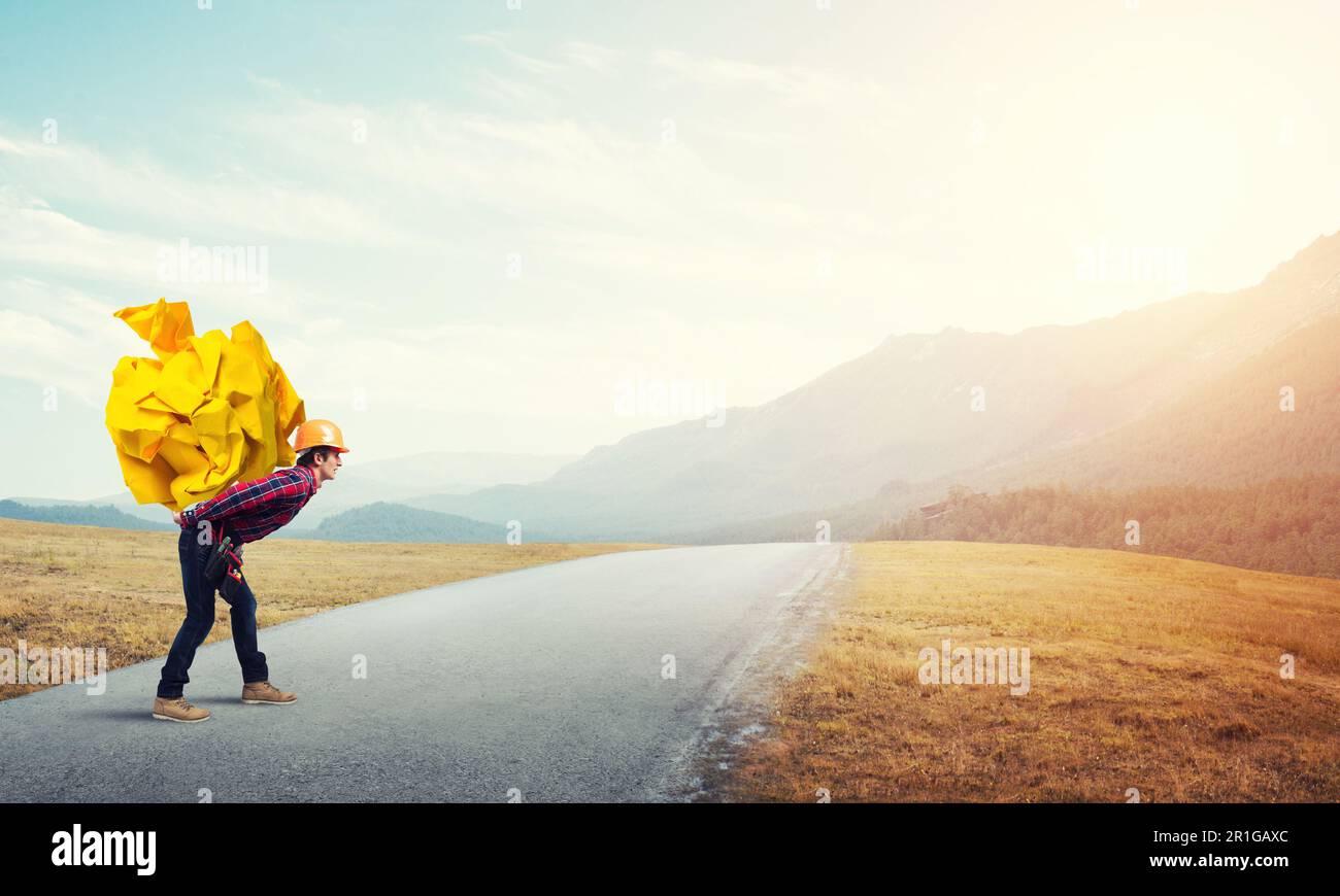 Engineer man carry load Stock Photo - Alamy
