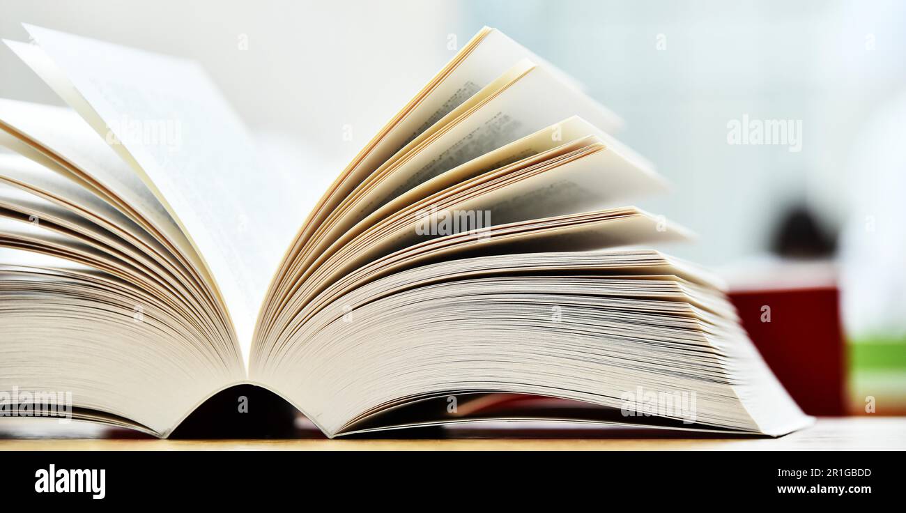 Books lying on the table in the public library Stock Photo - Alamy