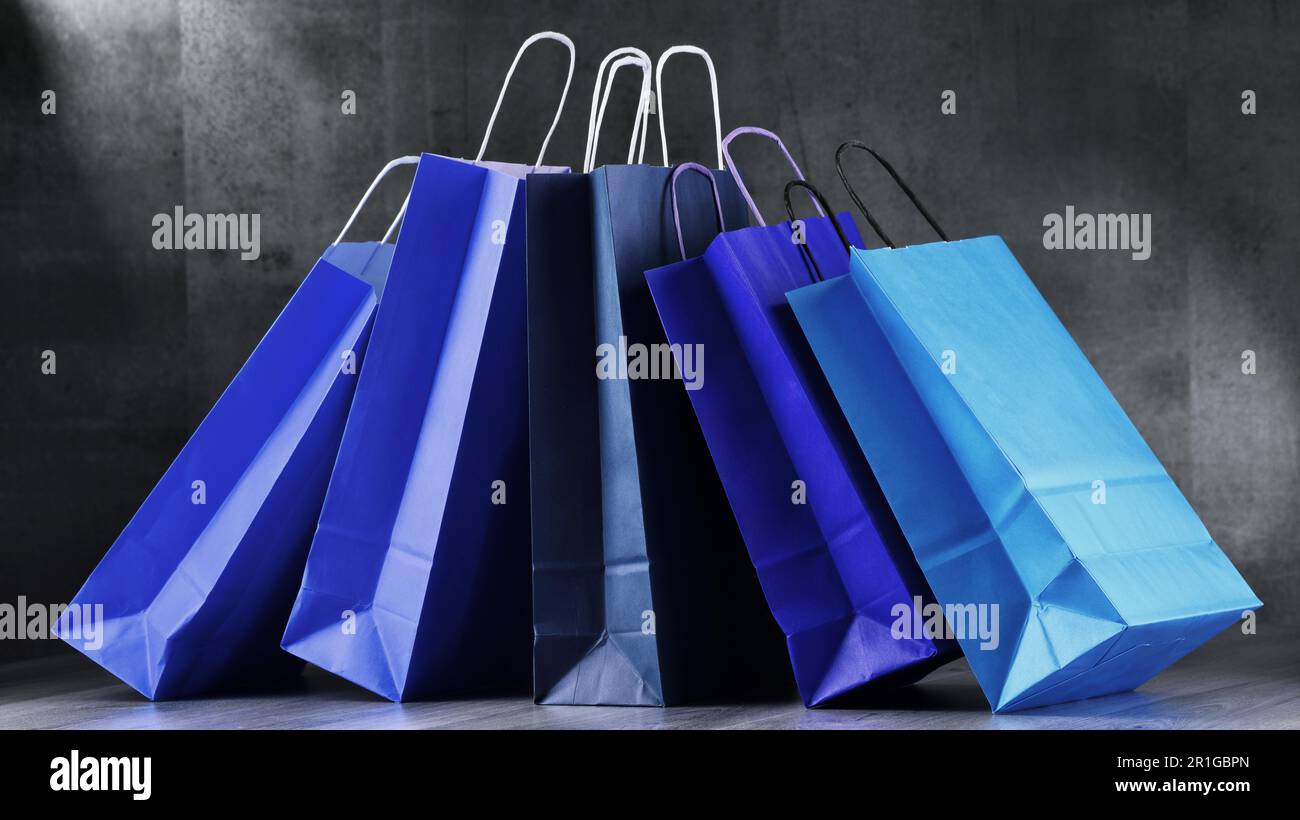Composition with blue paper shopping bags Stock Photo - Alamy