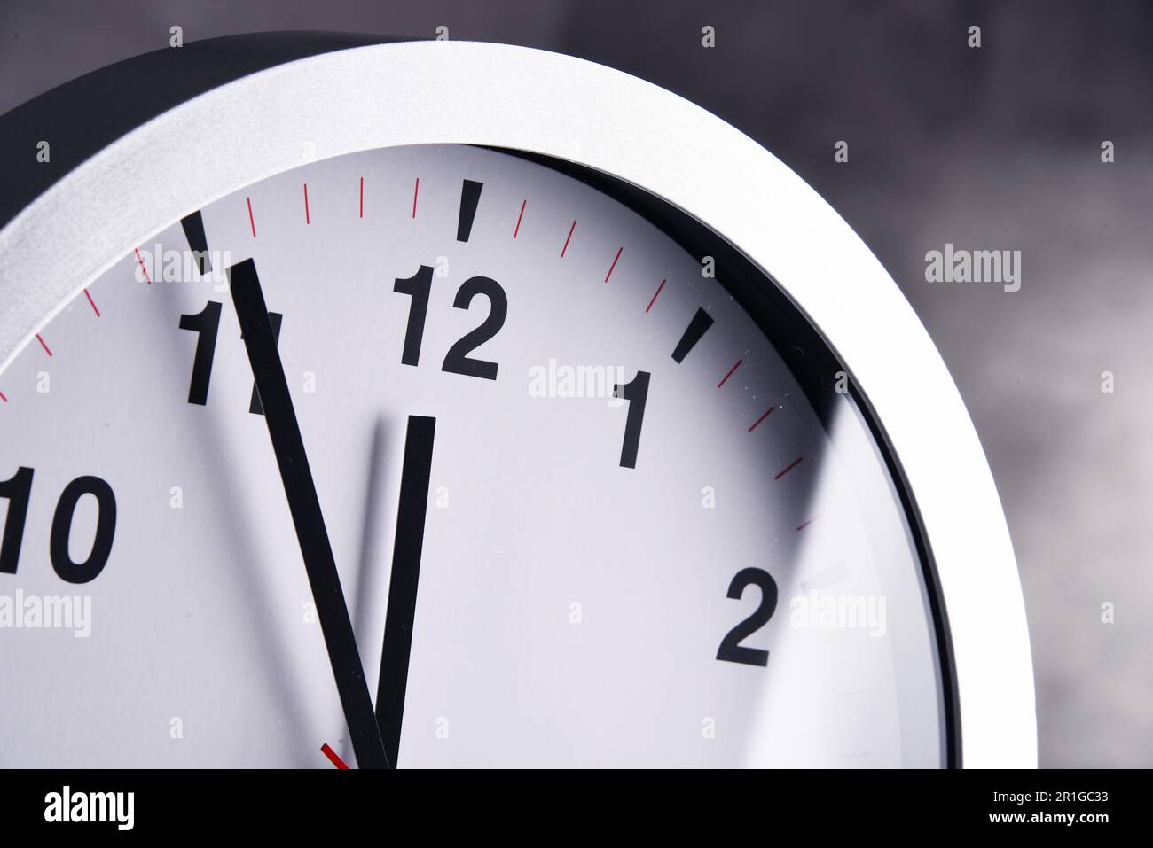 Wall clock showing five to twelve Stock Photo - Alamy