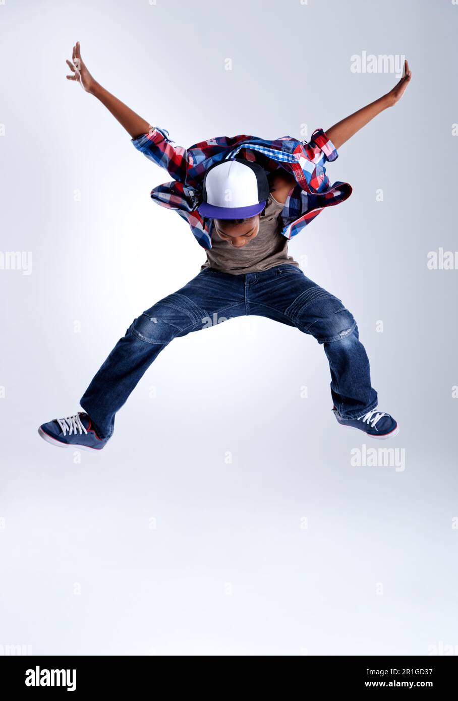 Talent, jump and child hip hop dancer dancing isolated in a white ...