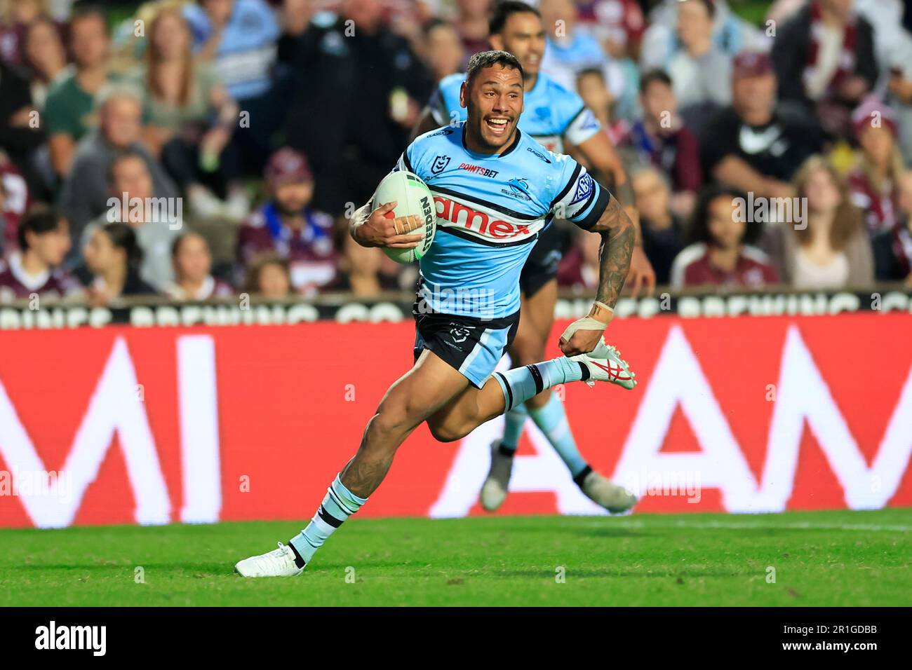 Jesse Ramien of the Sharks on his way to a try during the NRL Round 11 ...