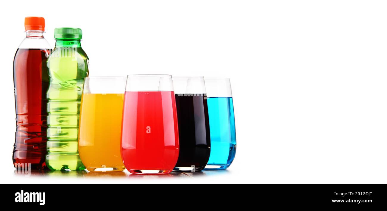 Glasses and bottles of assorted carbonated soft drinks isolated on ...