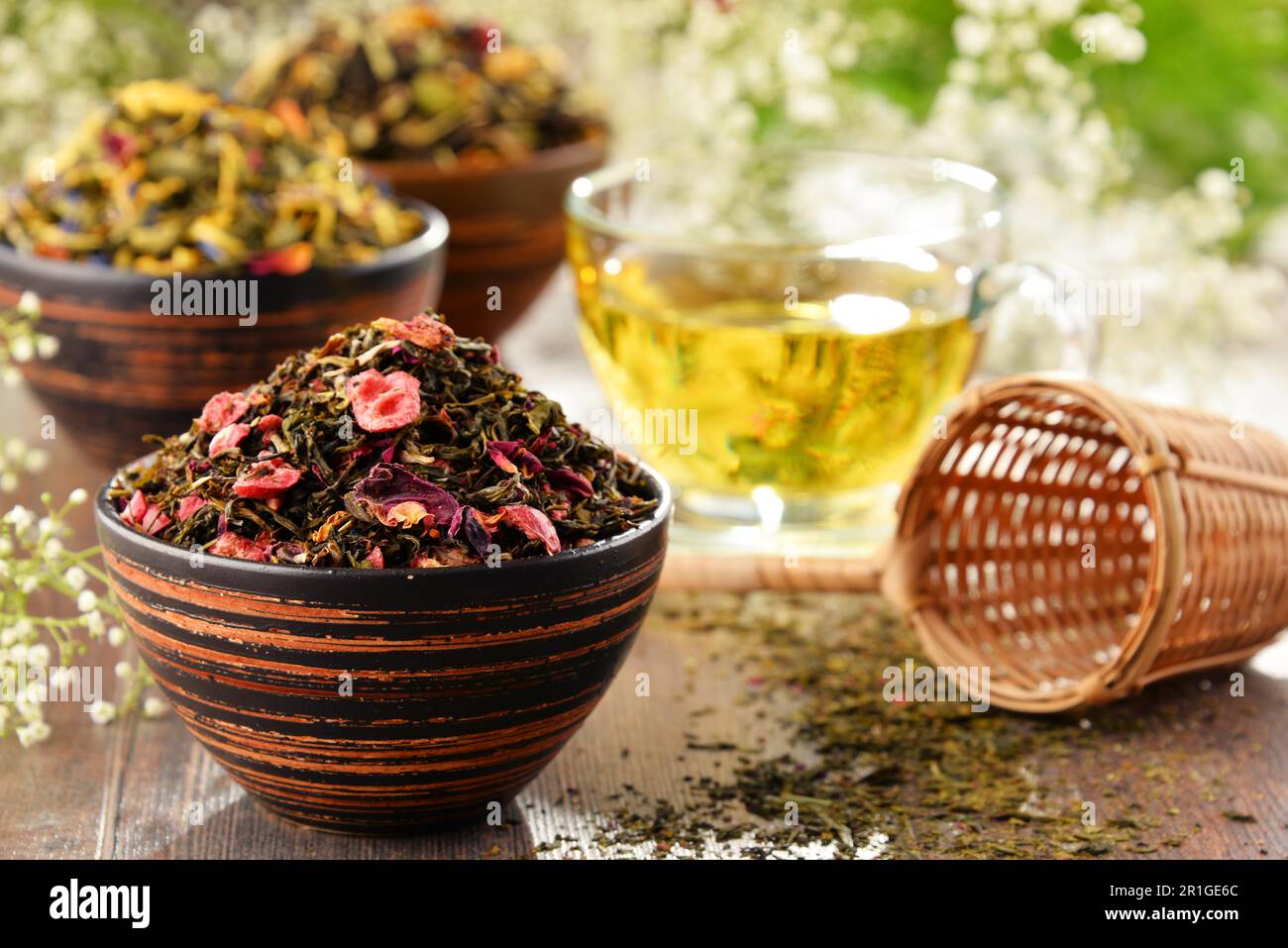 Composition with cup of tea and bowls of tea leaves Stock Photo - Alamy