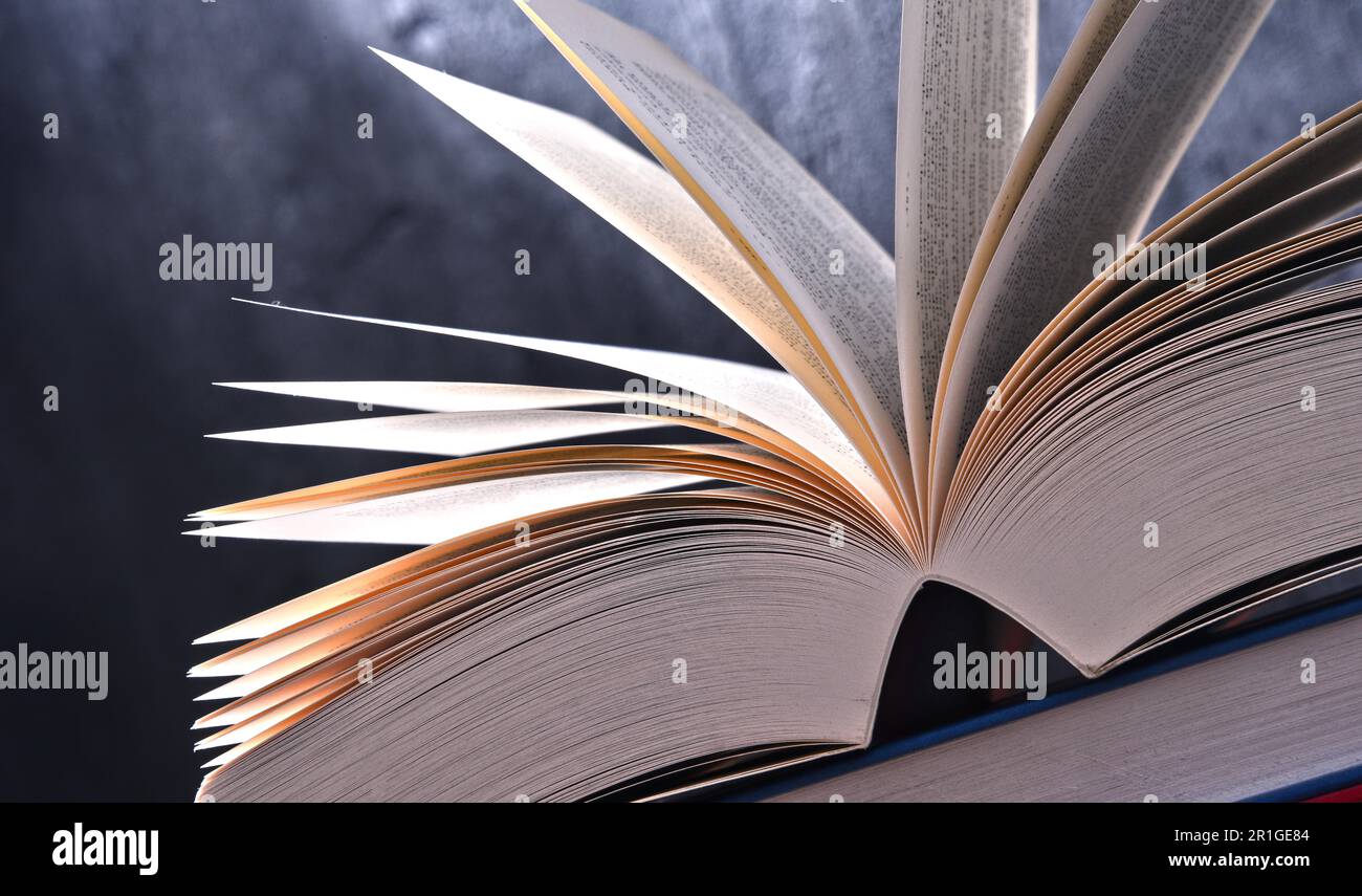 Composition with open book Stock Photo - Alamy