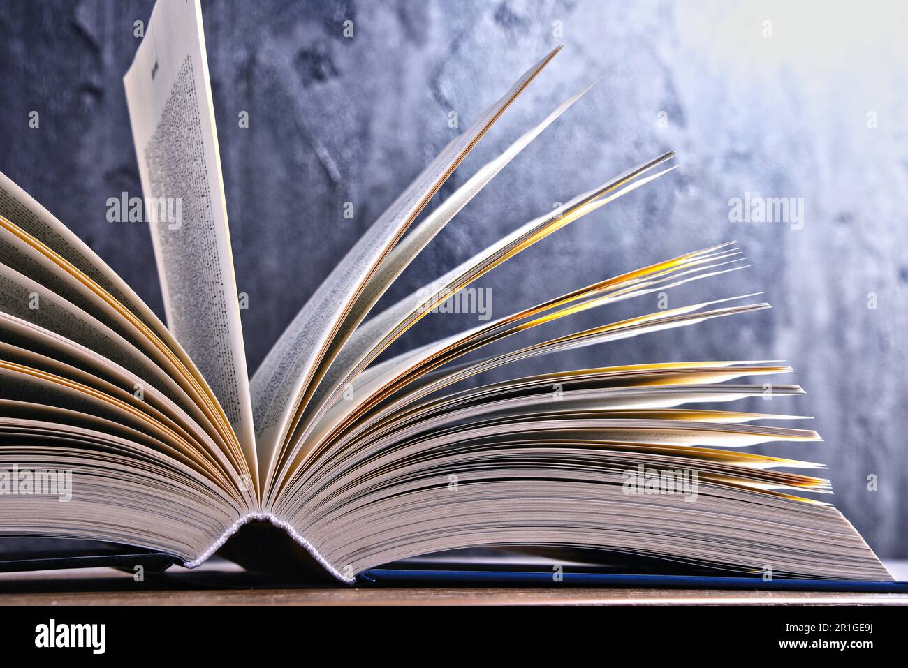 Composition with open book Stock Photo - Alamy