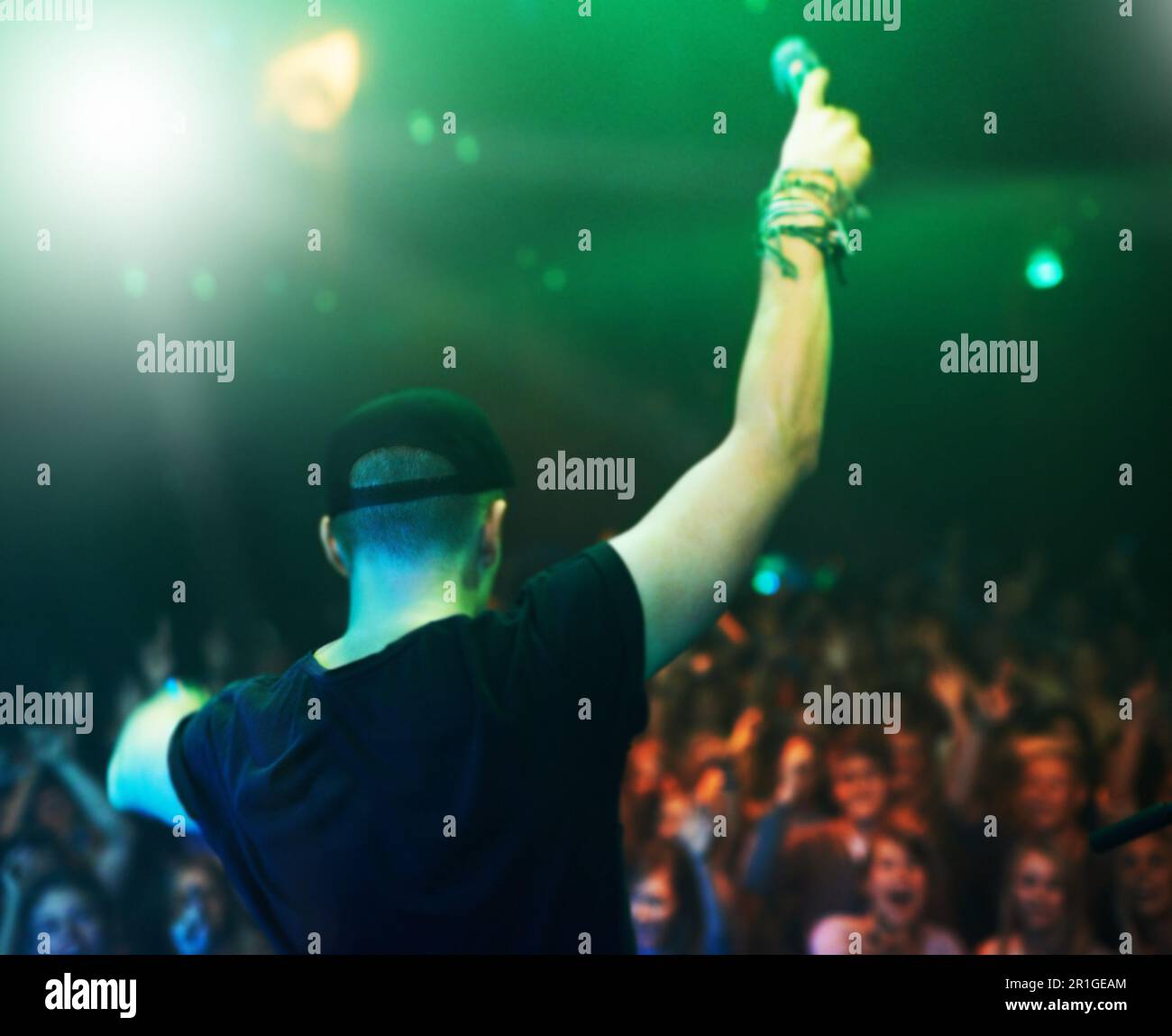 Music, rock and stage with man and microphone singing for concert ...