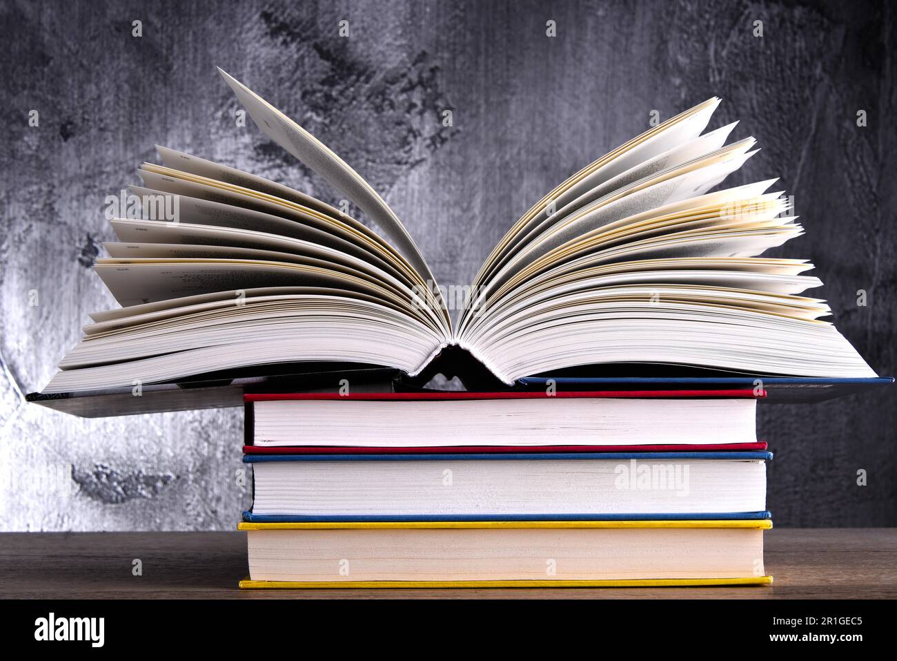 Composition with open book Stock Photo - Alamy