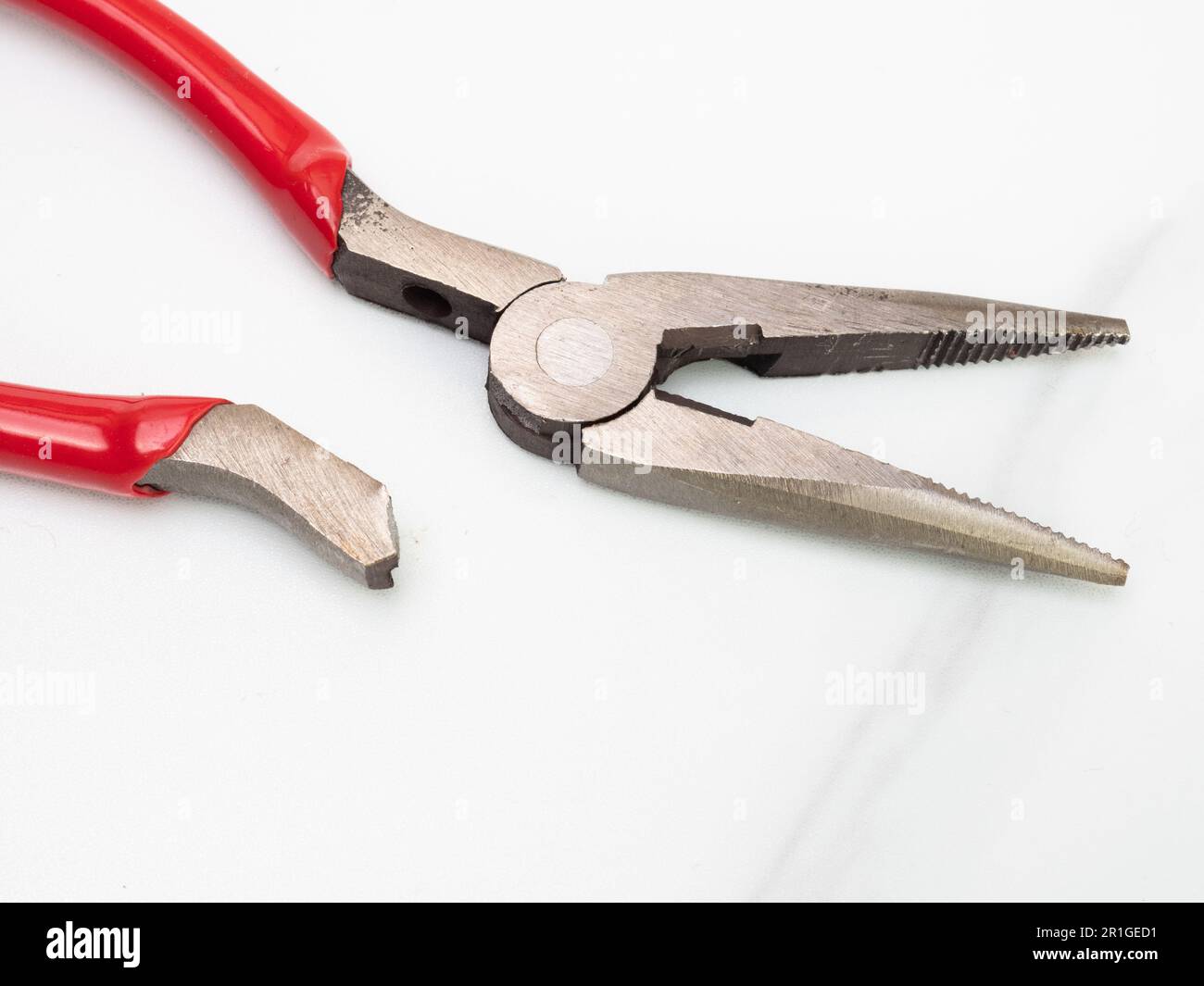 PIcture of a broken shap plier isolated on white Stock Photo - Alamy
