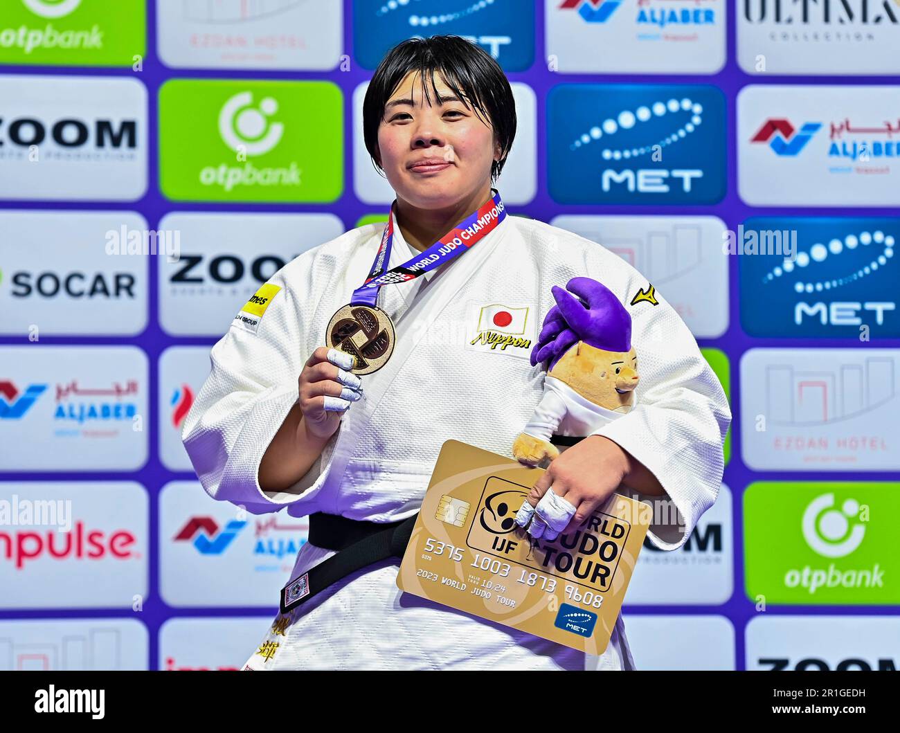 Doha. 13th May, 2023. Gold medalist Sone Akira of Japan poses on the podium during the awarding ...