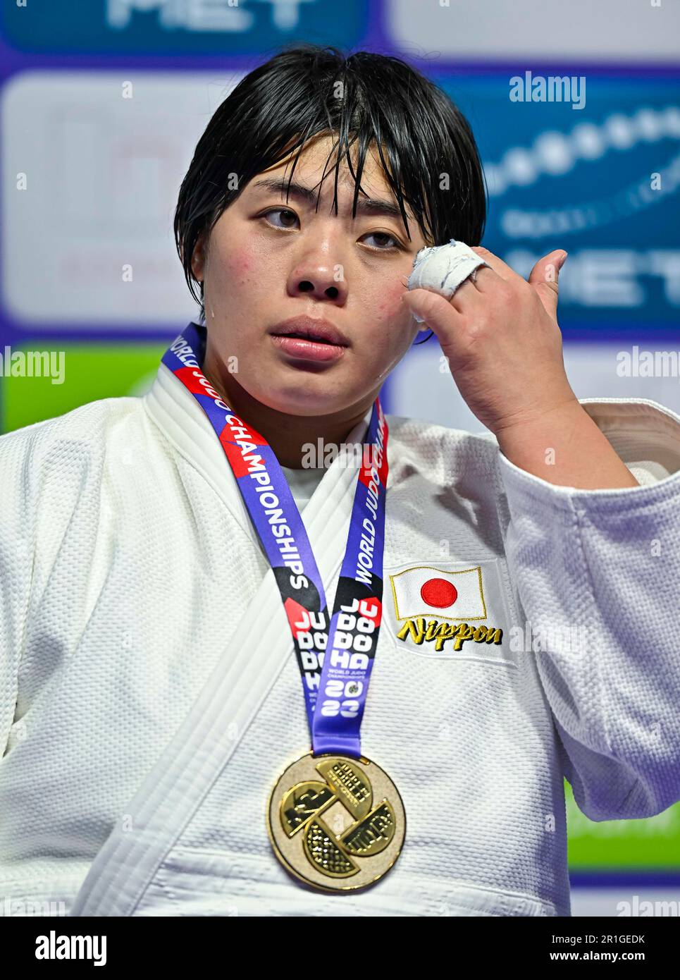 Doha. 13th May, 2023. Gold medalist Sone Akira of Japan reacts on the podium during the awarding ...