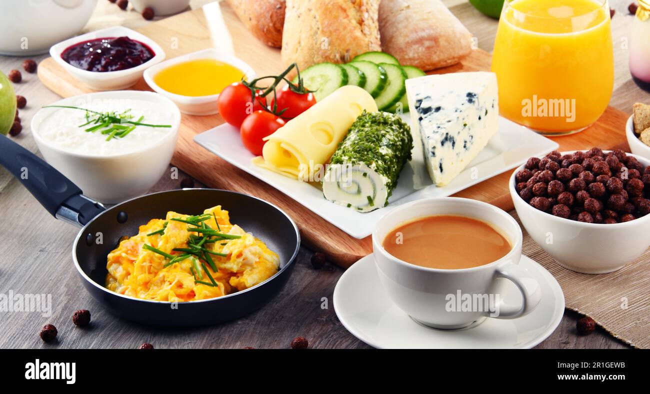 Breakfast served with coffee, orange juice, cheese, cereals and ...